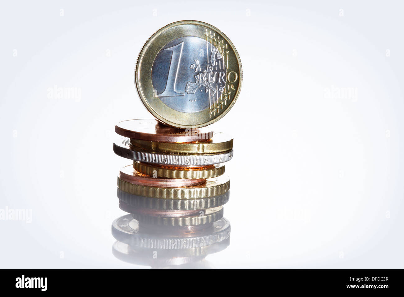 One euro coin on stack of cent coins Stock Photo - Alamy