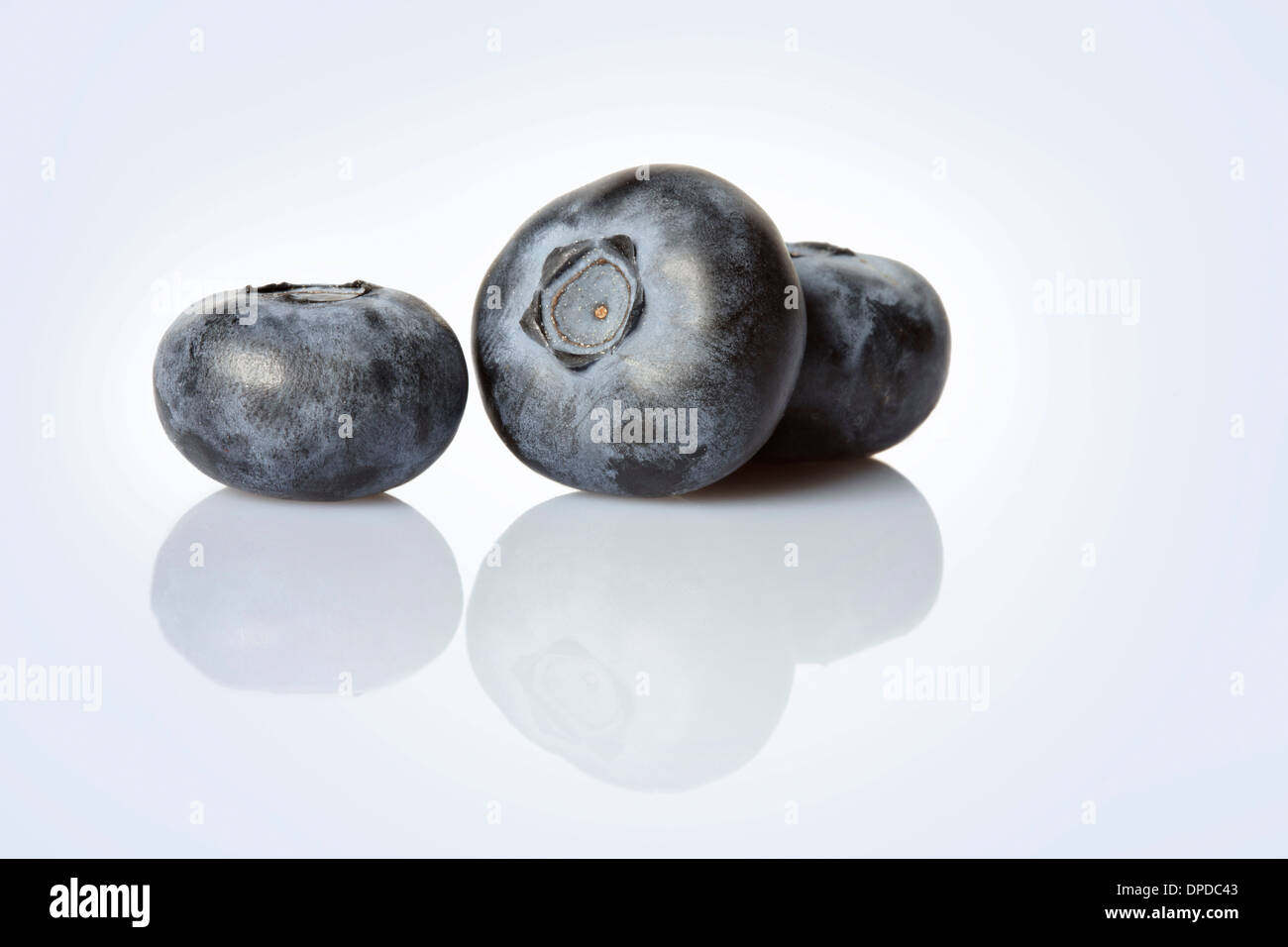 Three blueberries, close up Stock Photo - Alamy