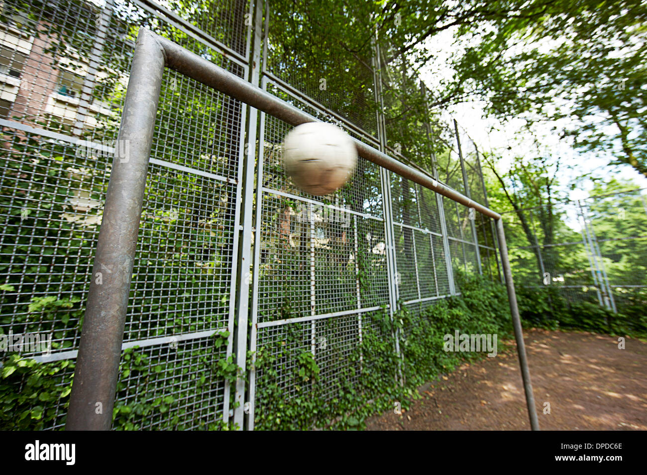 Soccer ball mid-air at goal Stock Photo - Alamy