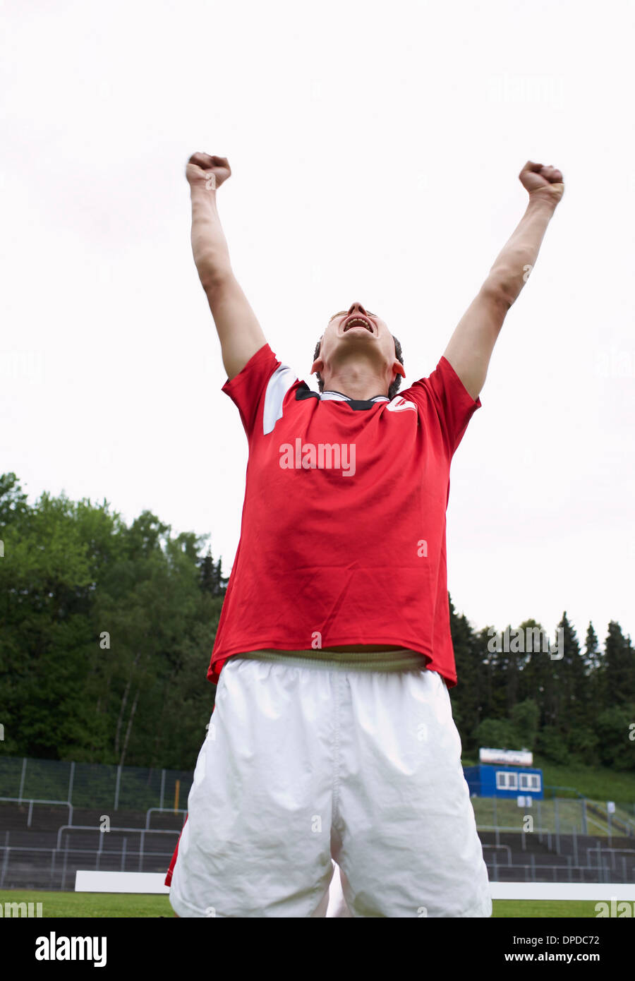 Soccer player celebrating Stock Photo - Alamy