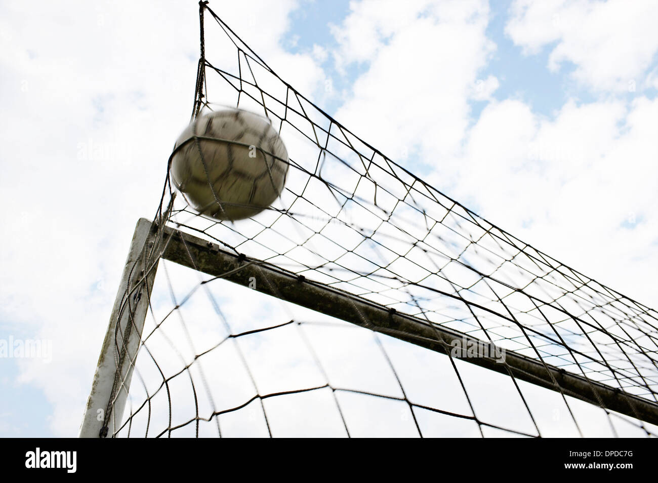 Soccer ball in goal Stock Photo - Alamy