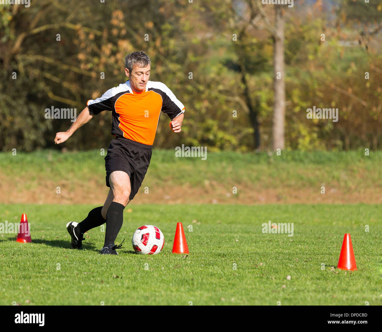 Football player passing a ball hi-res stock photography and images - Alamy