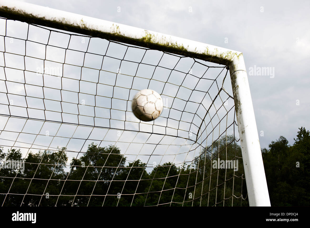 Soccer ball in goal Stock Photo - Alamy