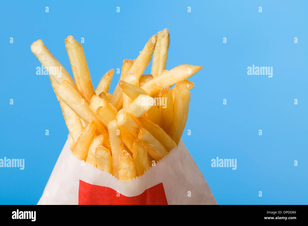 French fries in paper bag, studio shot Stock Photo - Alamy