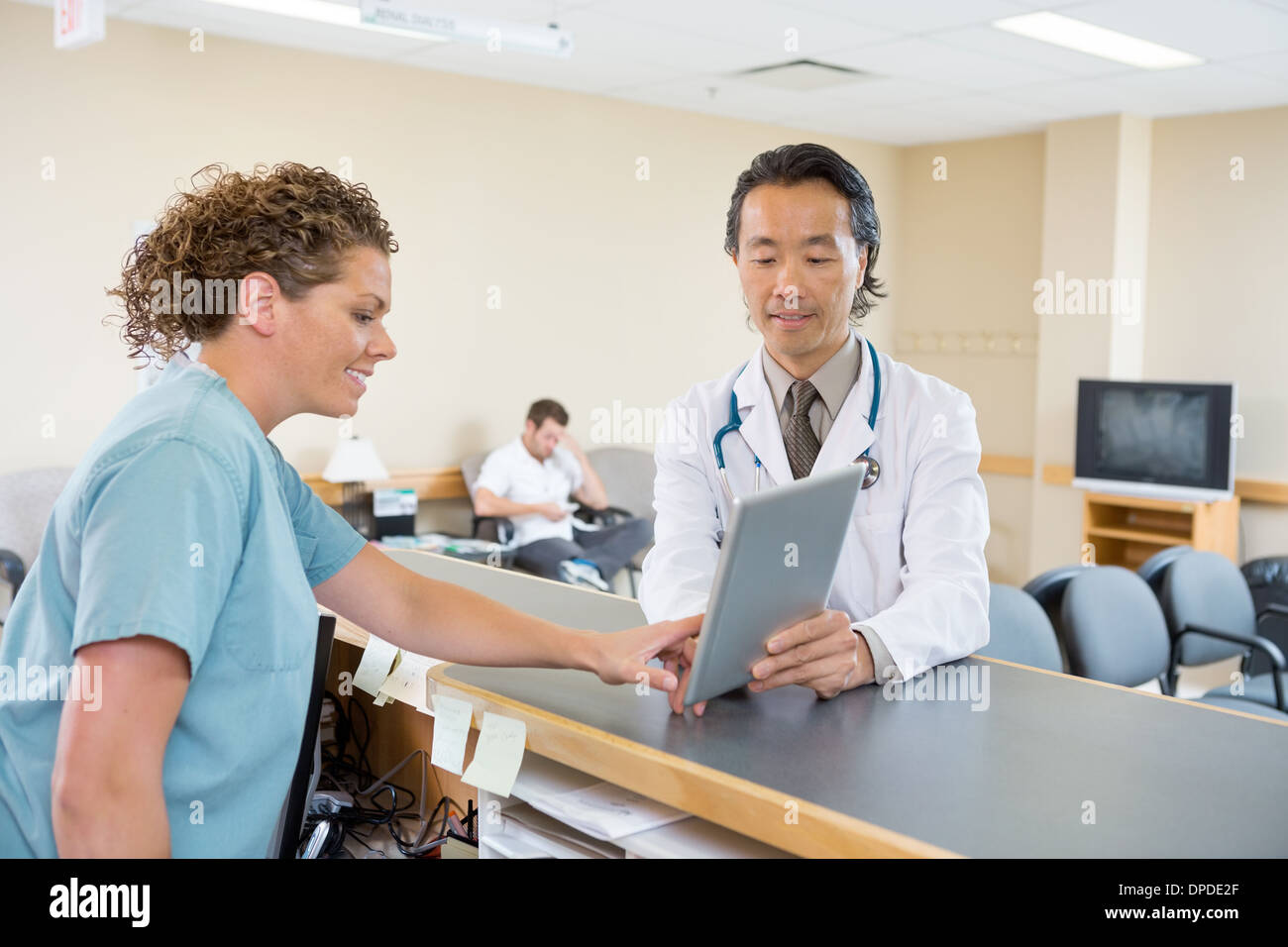 Female receptionist holding digital tablet hi-res stock photography and ...