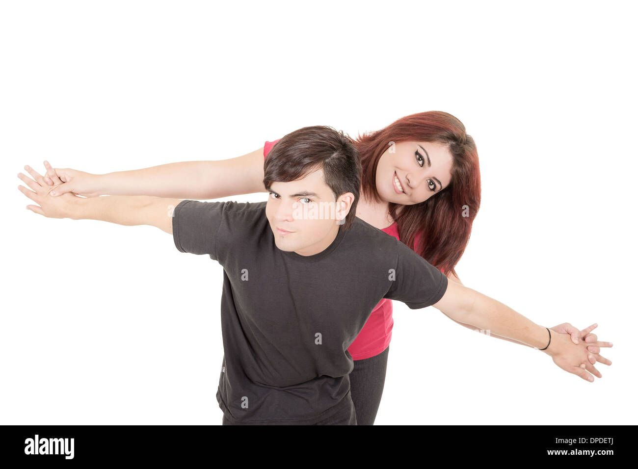 Happy alternative couple with arms open flying Stock Photo - Alamy