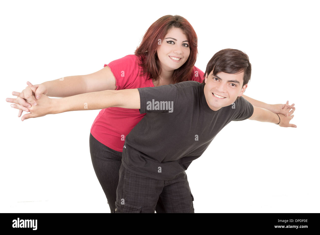 Happy alternative couple with arms open flying Stock Photo - Alamy