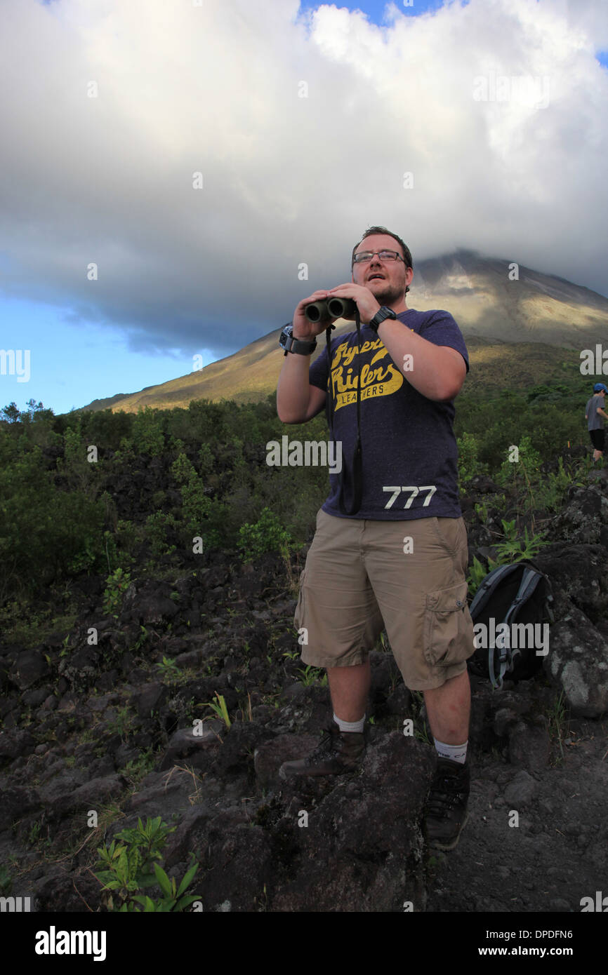 Tourist climbing Arenal Volcano Stock Photo - Alamy