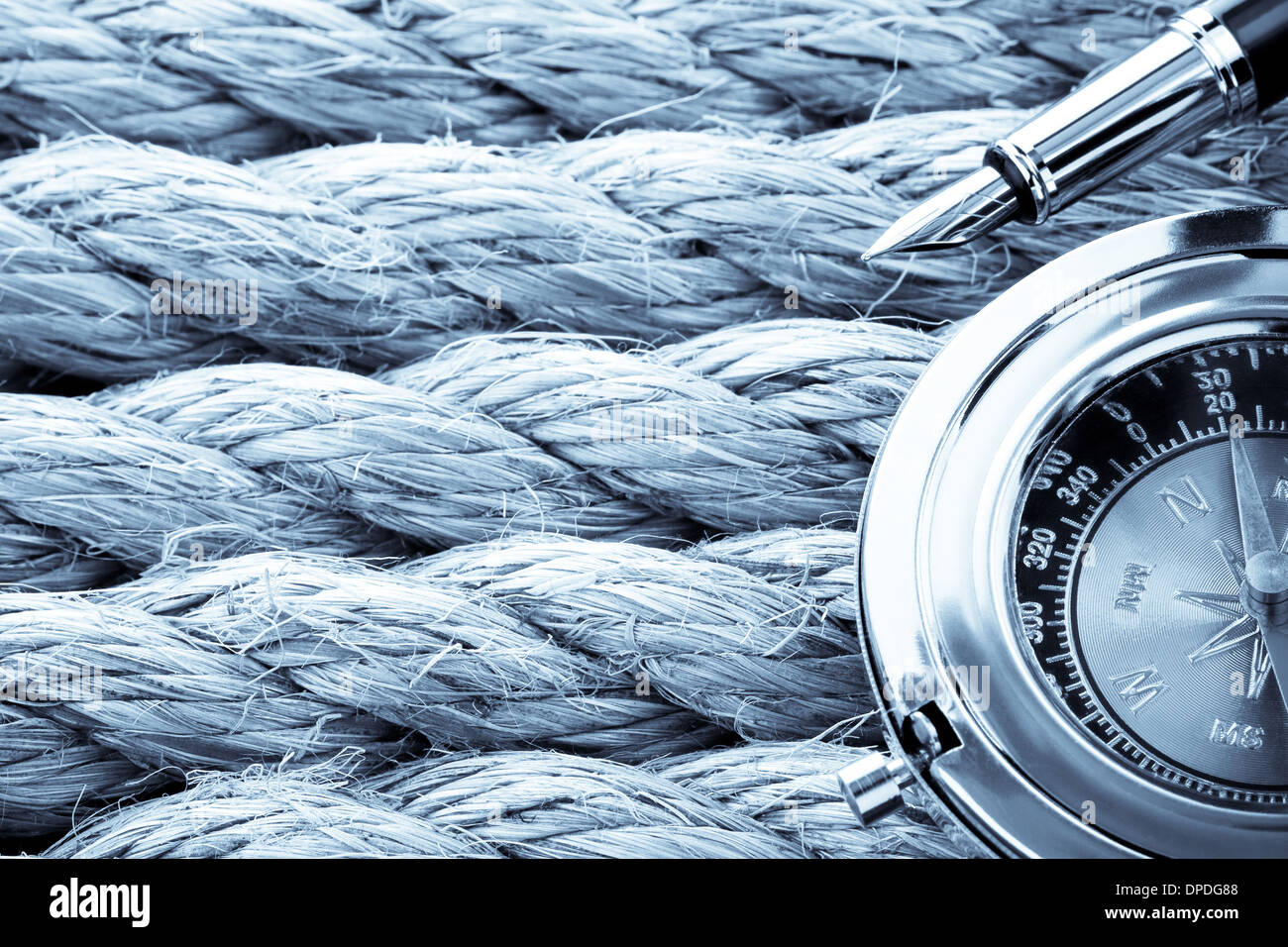 compass with ink pen on ship ropes Stock Photo - Alamy