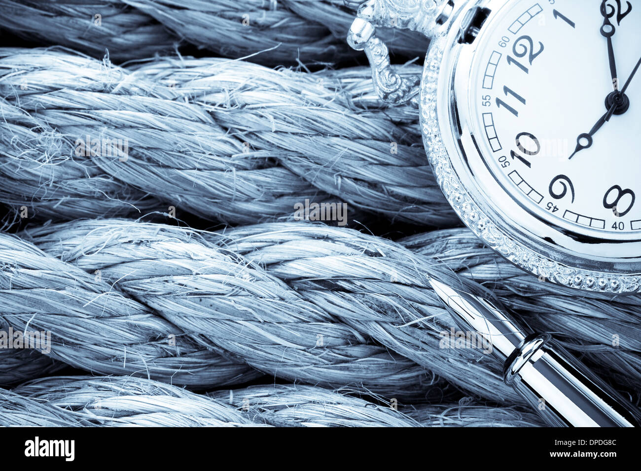 pocket watch with ink pen on ship ropes Stock Photo - Alamy