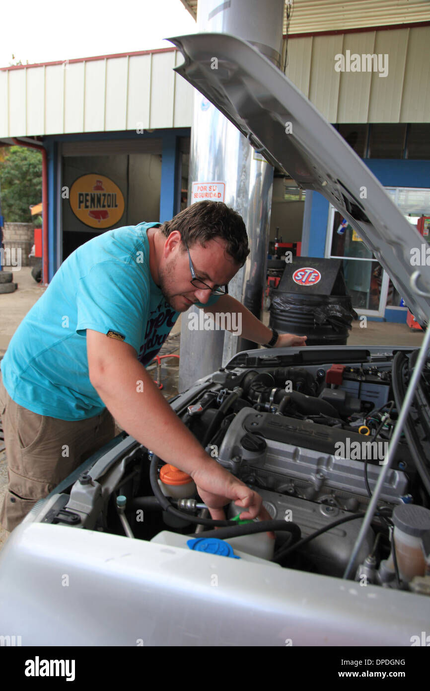 Man fixing car Stock Photo - Alamy