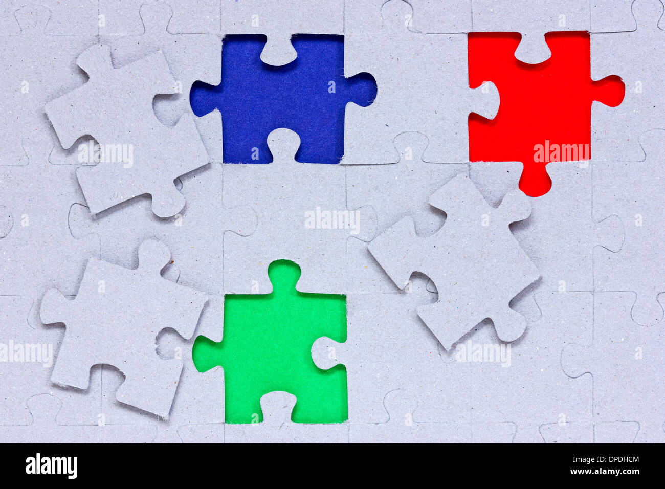 Jigsaw puzzle with different colored pieces signifying concepts of ...