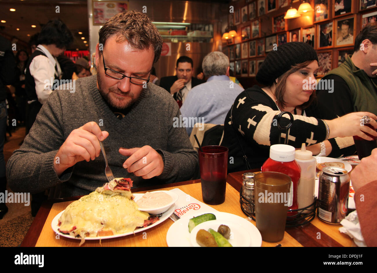Young man eating food Stock Photo - Alamy