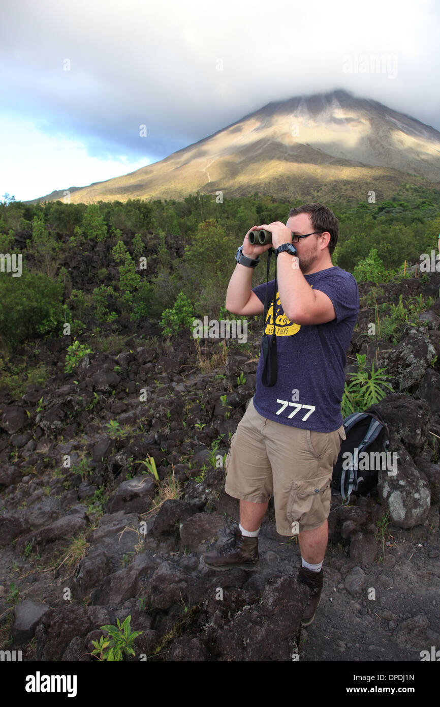 Tourist climbing Arenal Volcano Stock Photo - Alamy