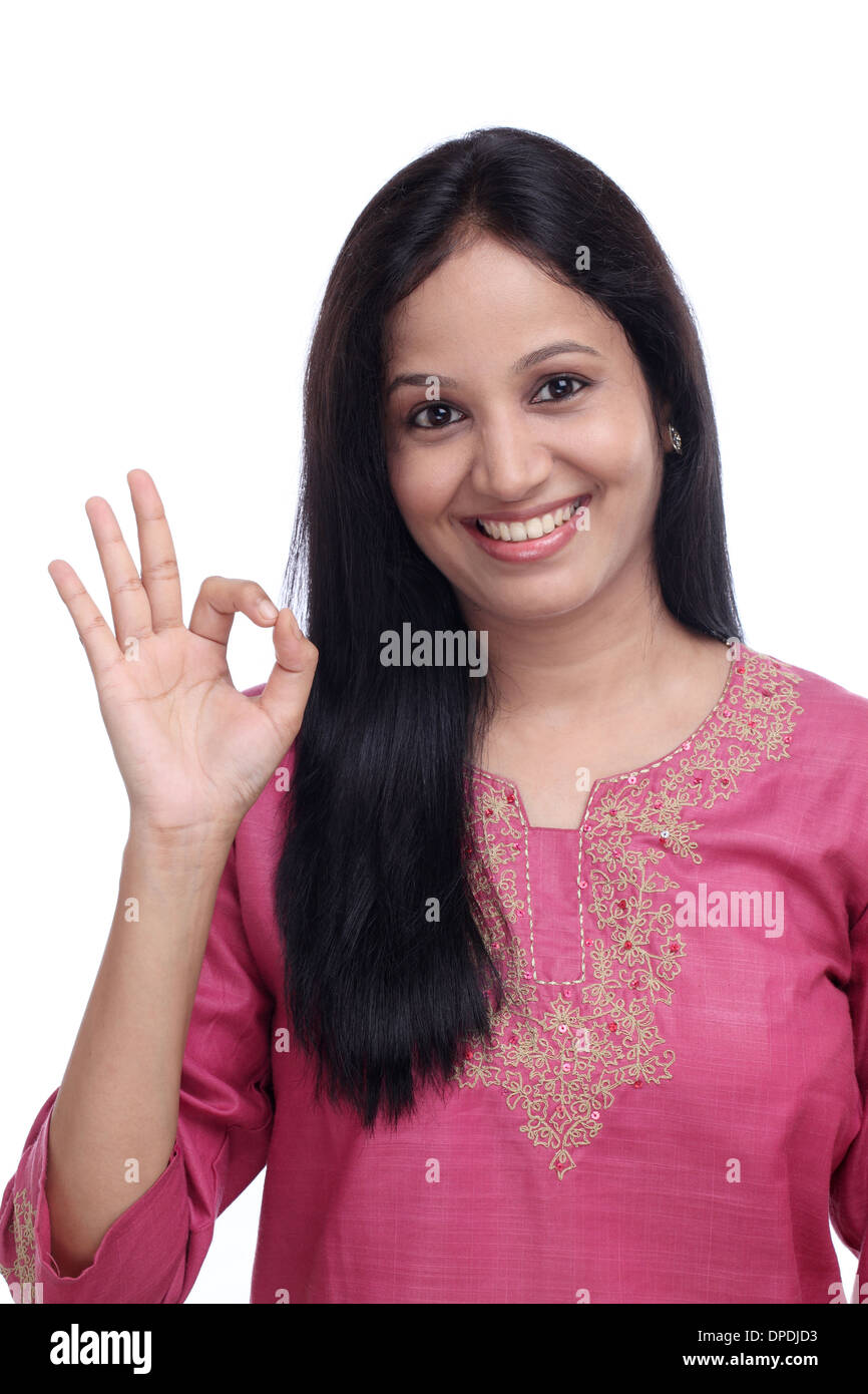 Smiling young indian woman showing OK sign gesture Stock Photo - Alamy