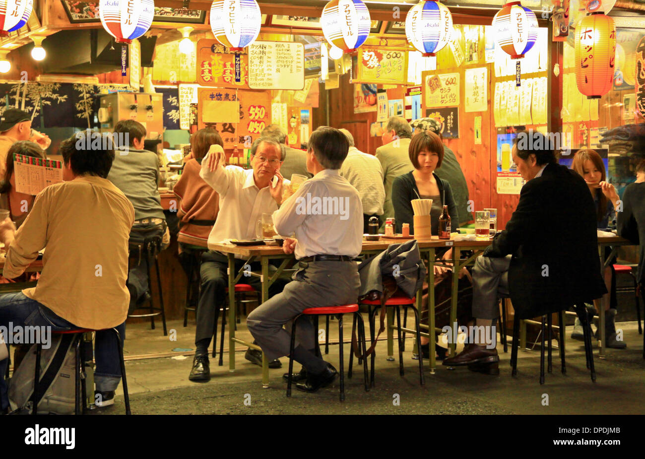 Japanese street life and dining out at night in Asakusa, Tokyo, Japan ...