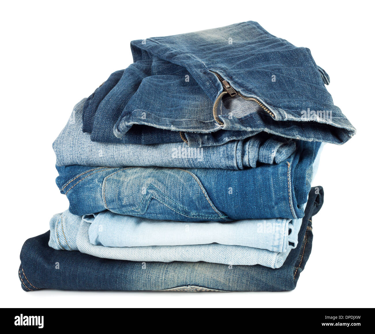 A stack of folded jeans isolated on white background Stock Photo - Alamy