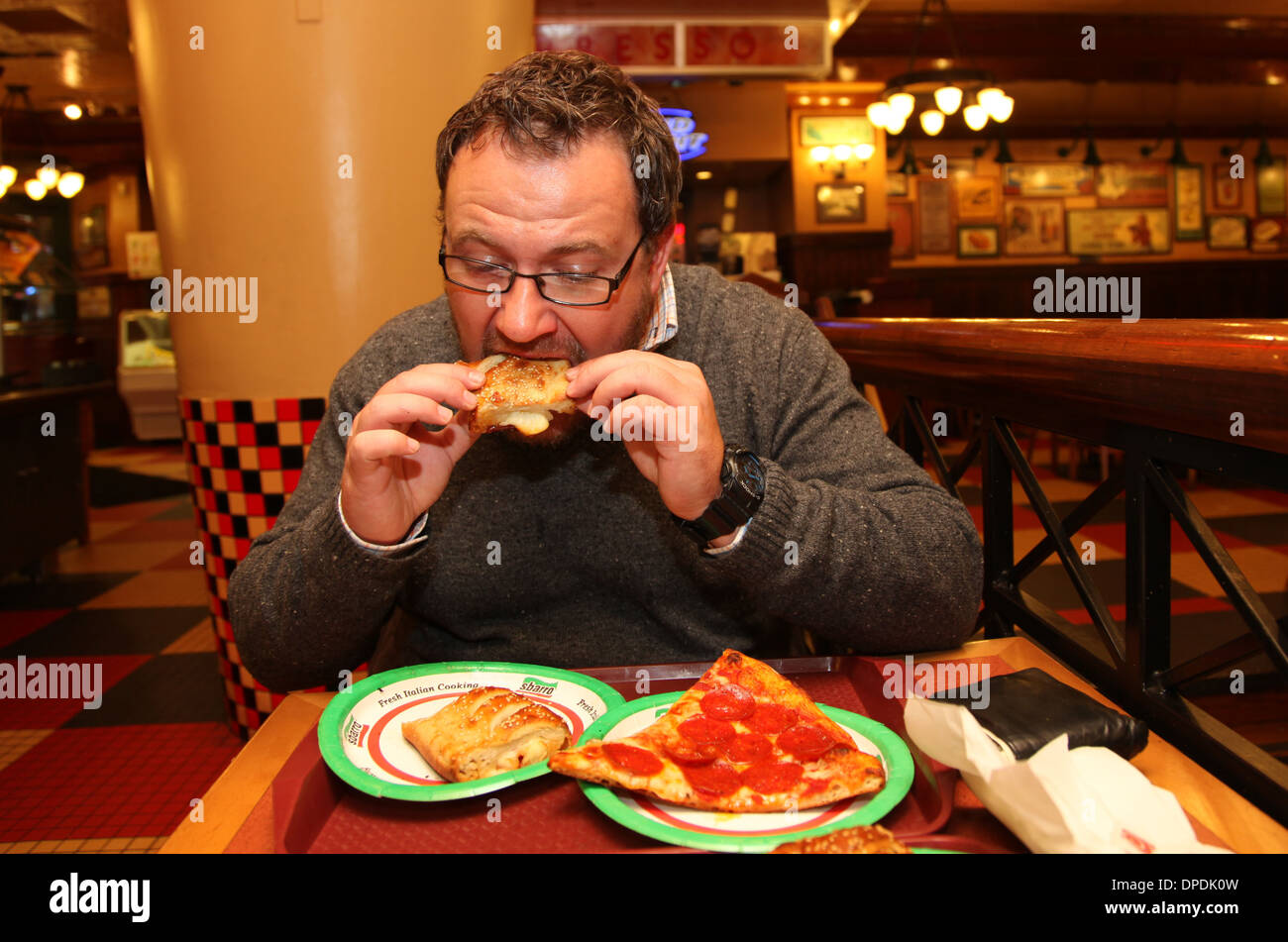 Man eating too much hi-res stock photography and images - Alamy
