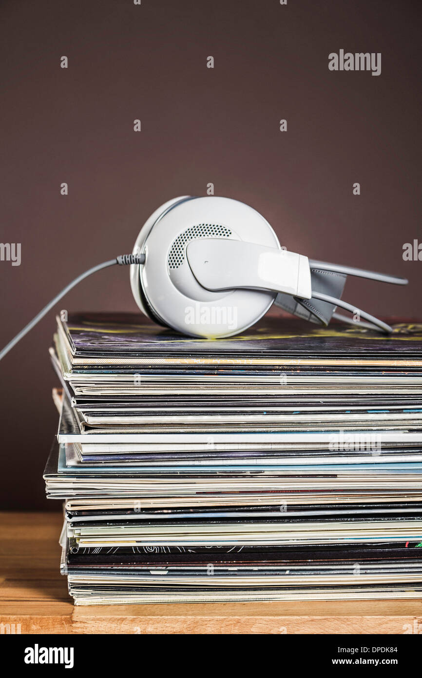 Stack of vinyl records with headphones Stock Photo - Alamy