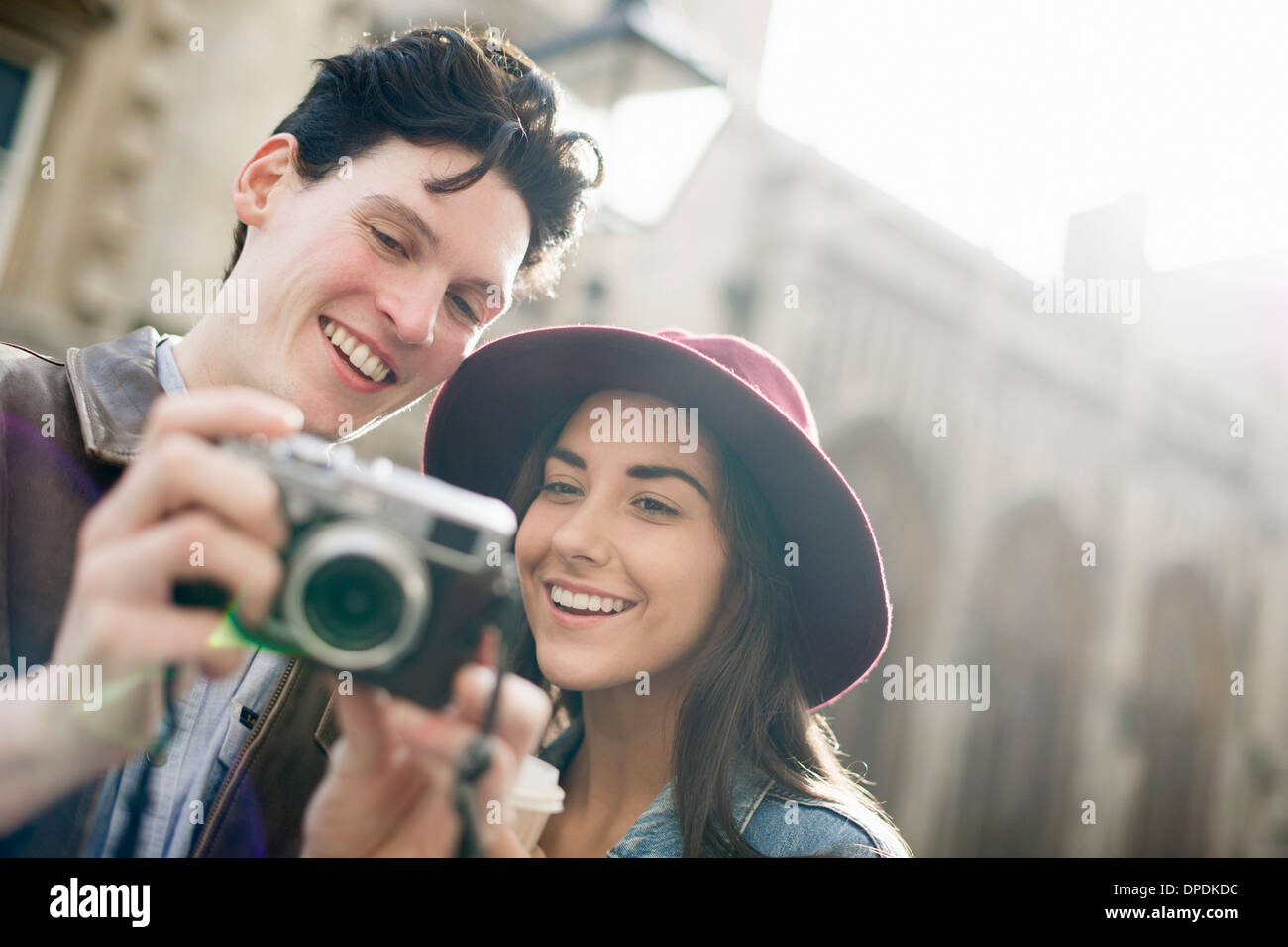 Woman smiling using vintage camera hi-res stock photography and images ...