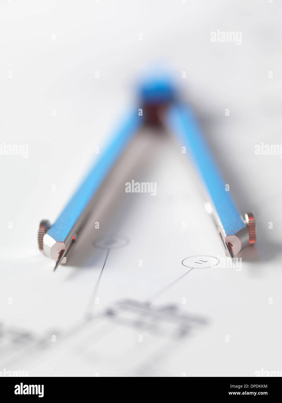 Dividers sitting on engineering drawing used in the measurement of ...