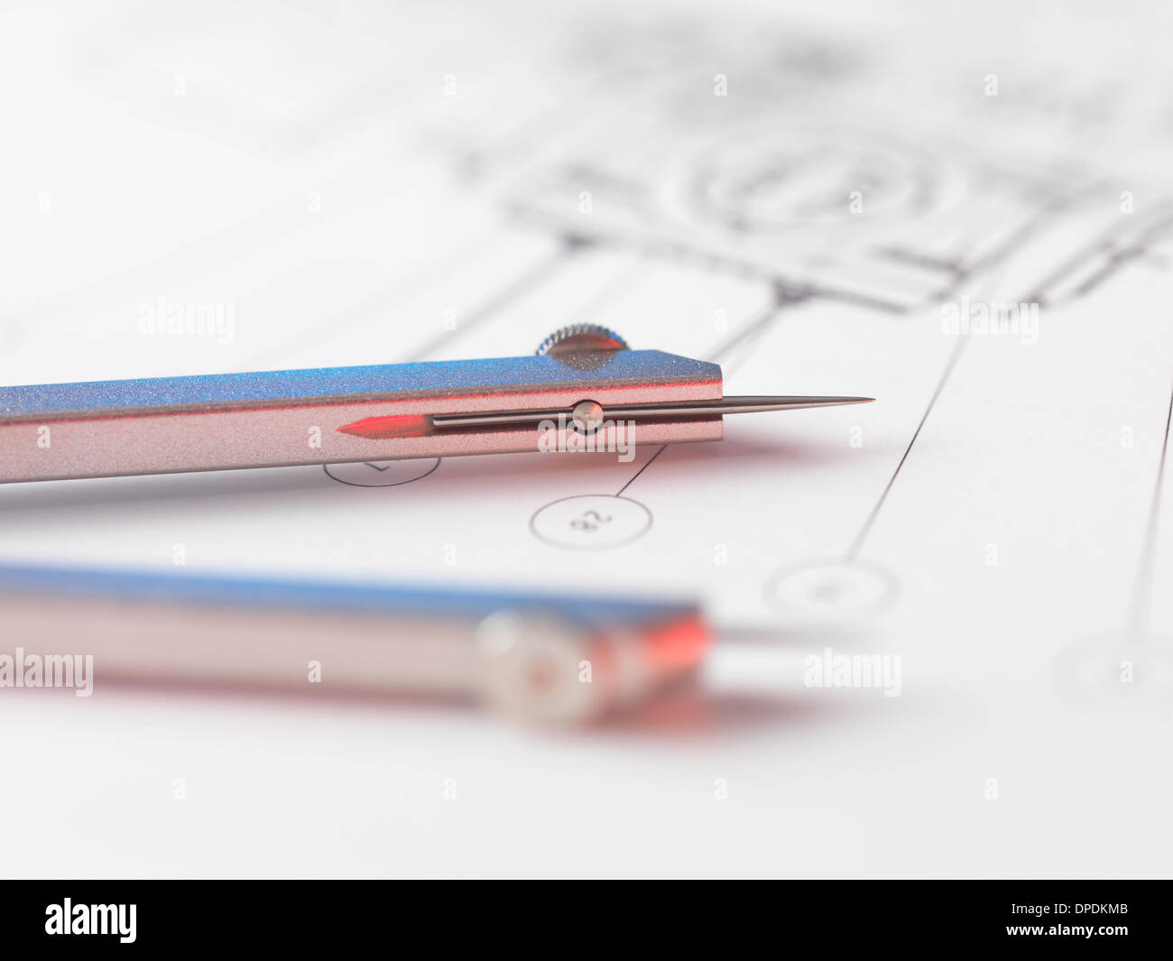 Dividers sitting on engineering drawing used in the measurement of ...
