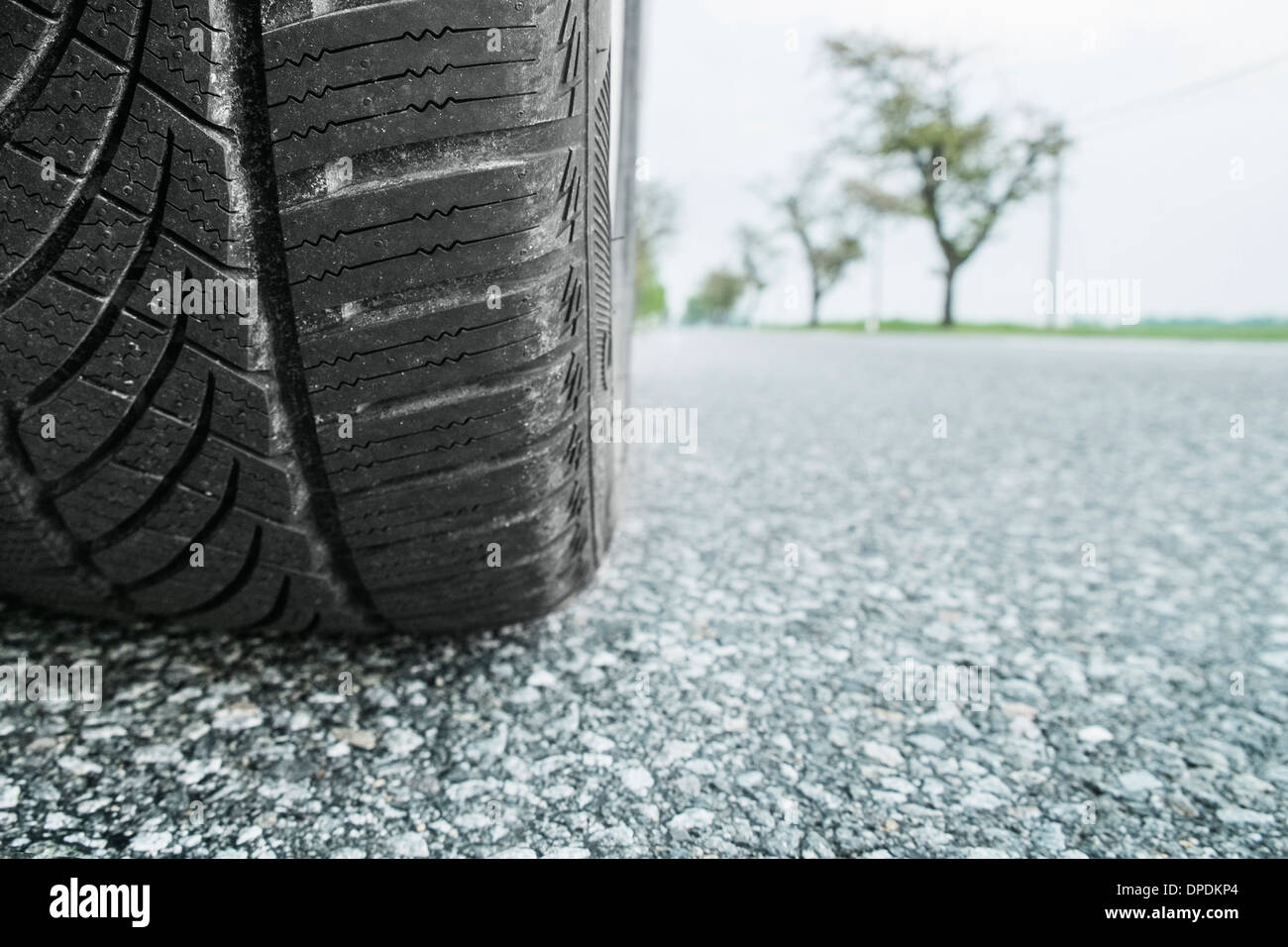 Car tire on road, close up Stock Photo - Alamy