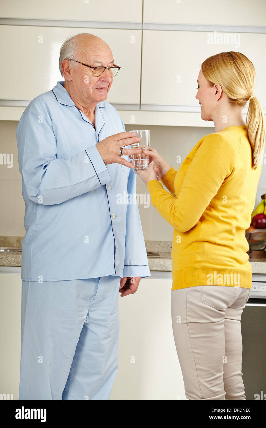 Nurse offering water patient hi-res stock photography and images - Alamy