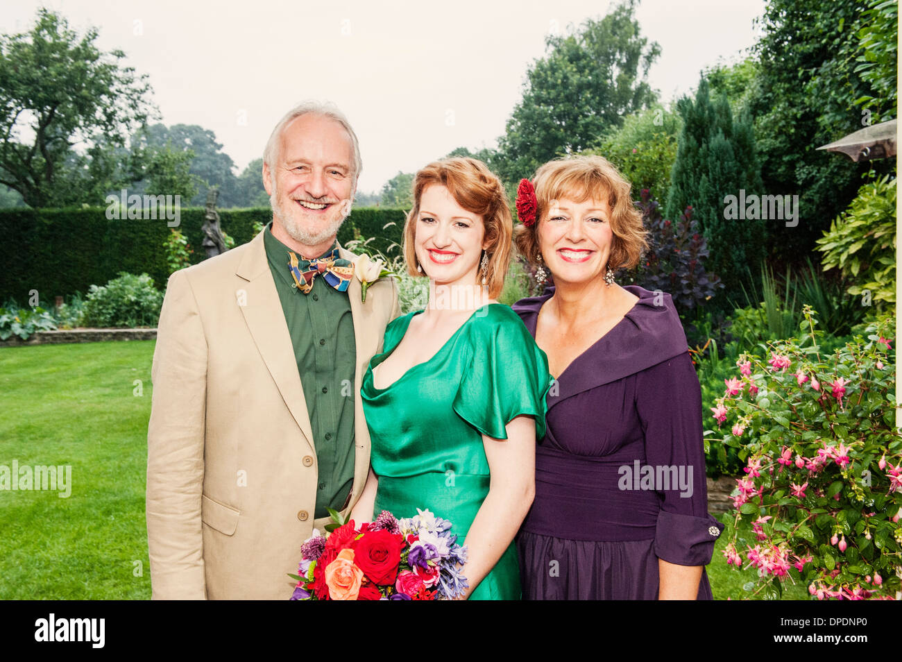 Portrait of newly married daughter with her parents Stock Photo - Alamy