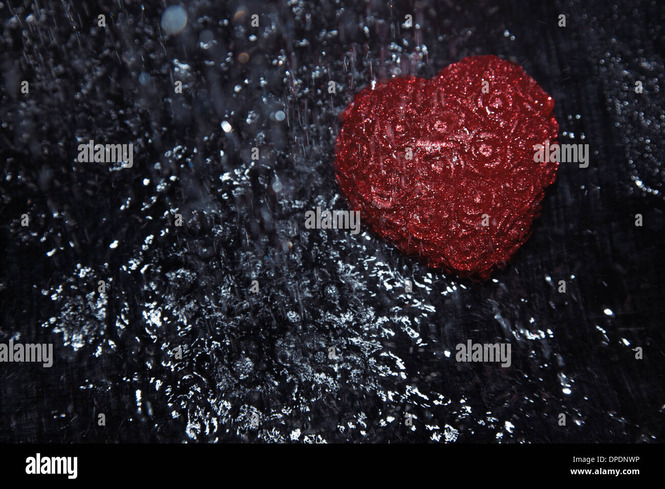 Heart shape in heavy rain. Close-up view Stock Photo - Alamy