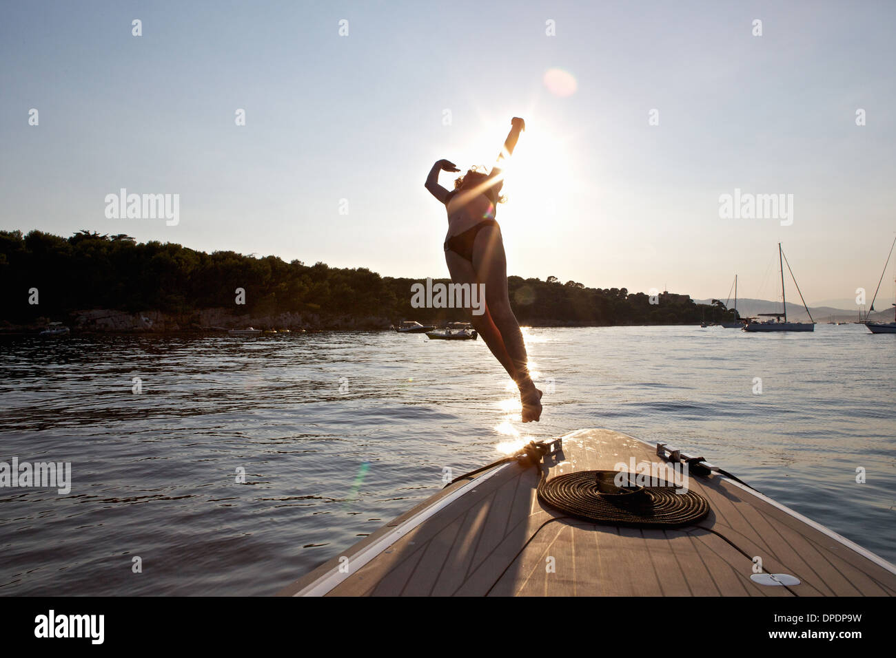 Woman diving from boat, Cannes Islands, Cote D'Azur, France Stock Photo ...