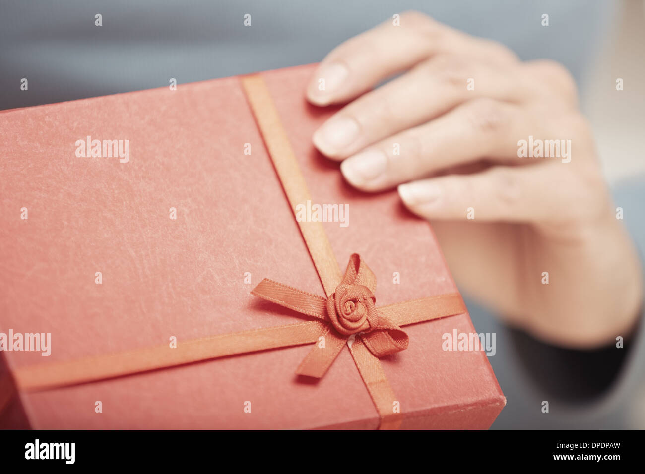 Hand opening red gift box hi-res stock photography and images - Alamy