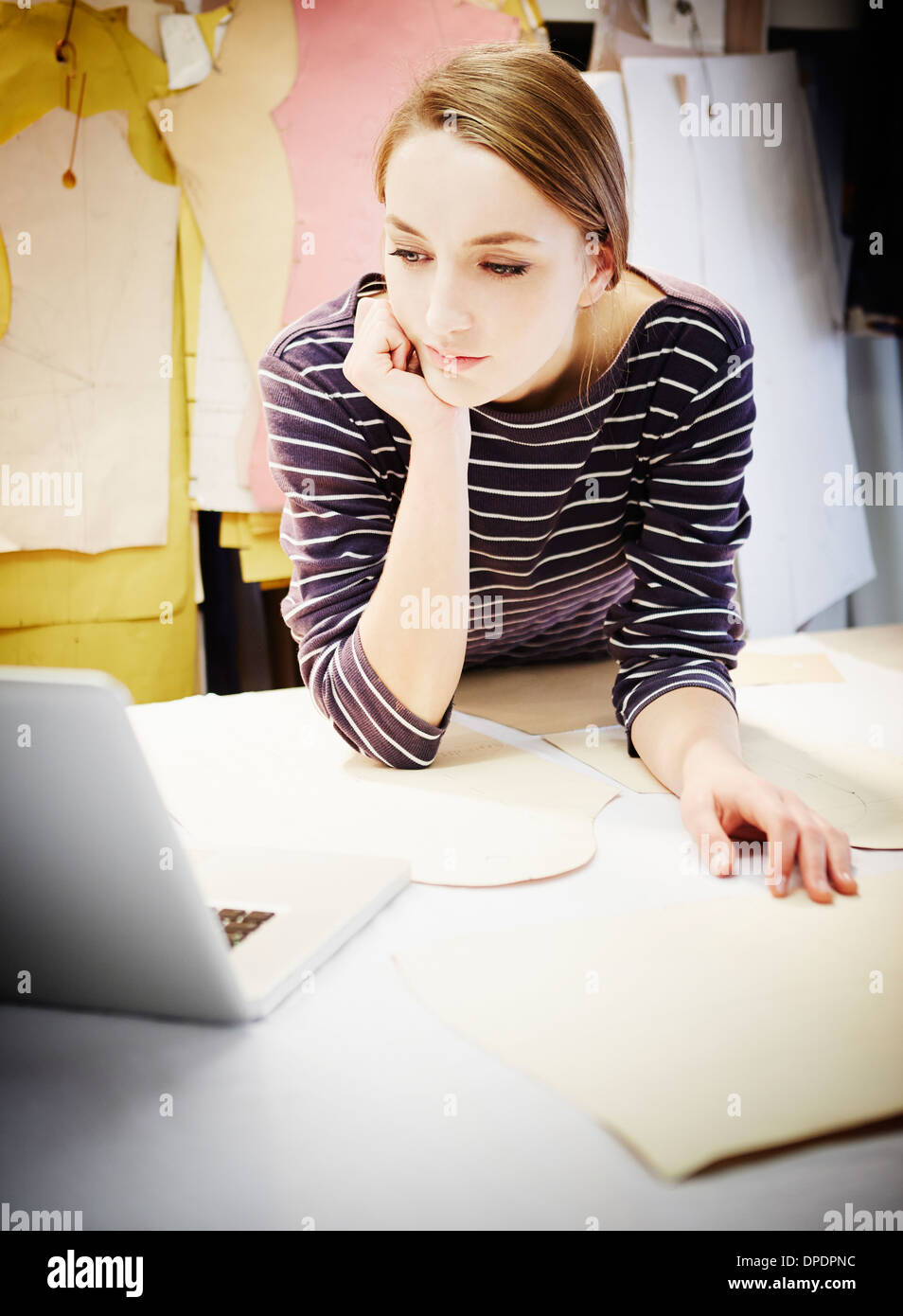 Working at table hi-res stock photography and images - Alamy