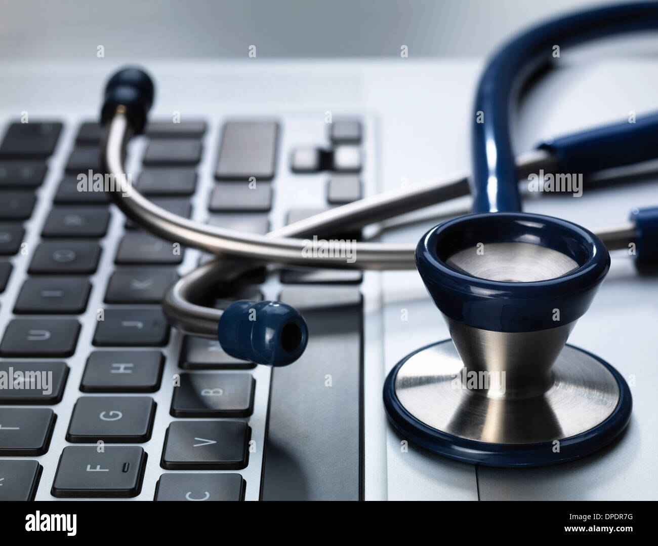 Stethoscope sitting on laptop illustrating online healthcare and doctor ...