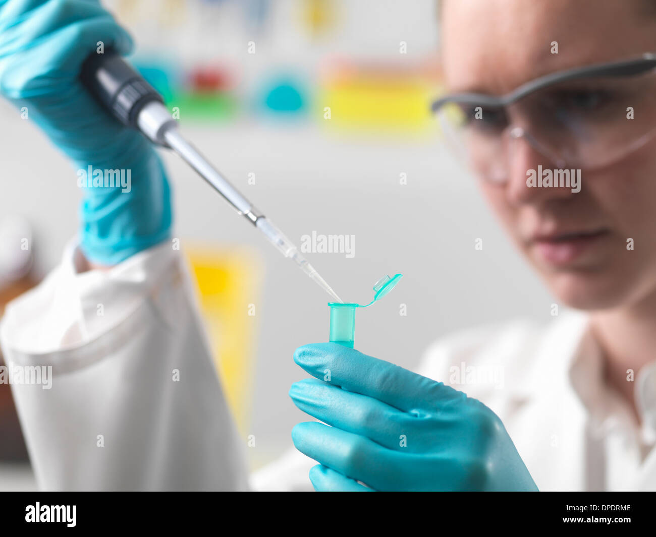 Laboratory worker pipetting sample into an eppendorf vial Stock Photo ...