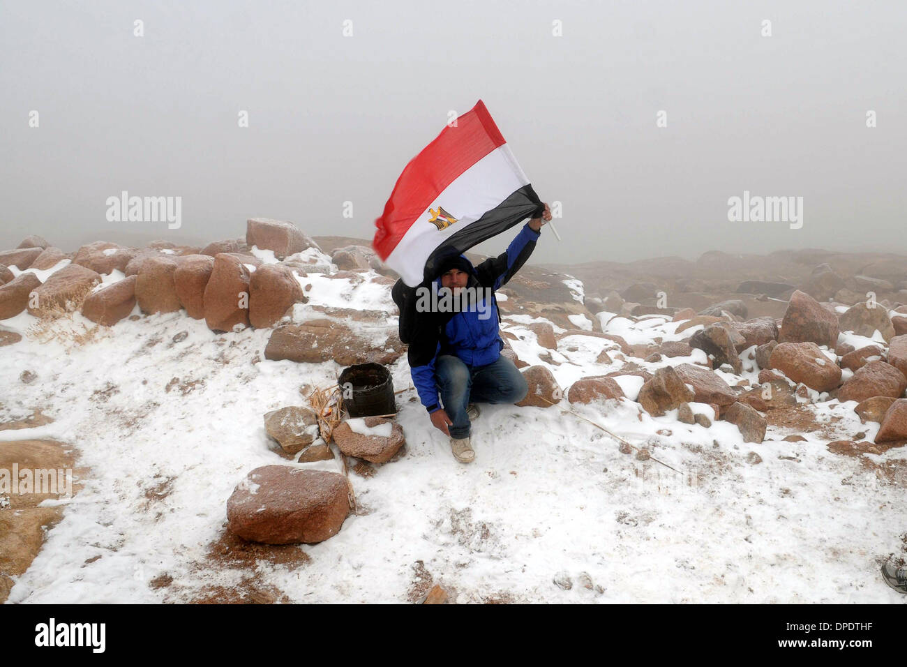 Sinai, Cairo, Egypt. 11th Jan, 2014. An Egyptian man holds his national ...