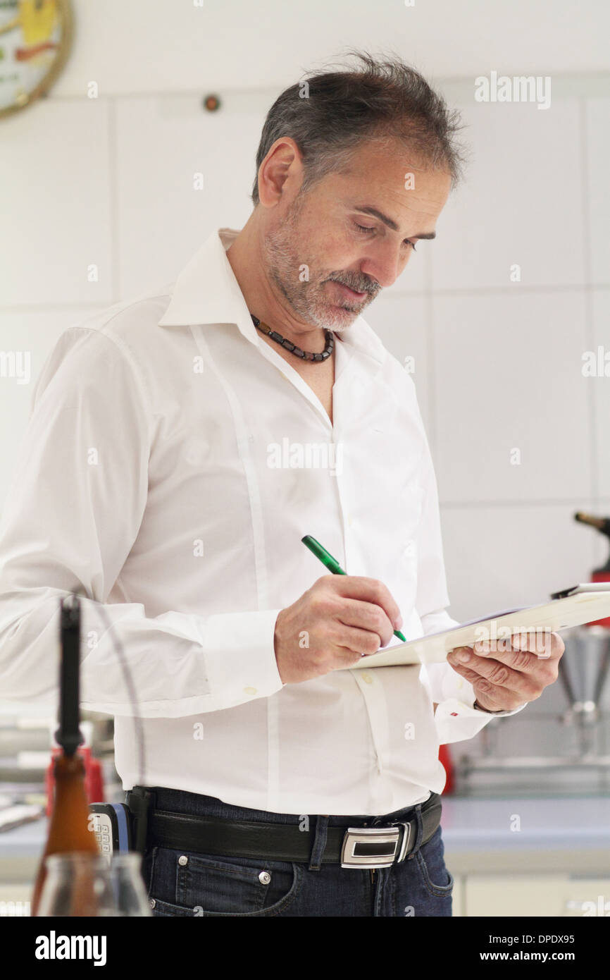 Completing paperwork hi-res stock photography and images - Alamy