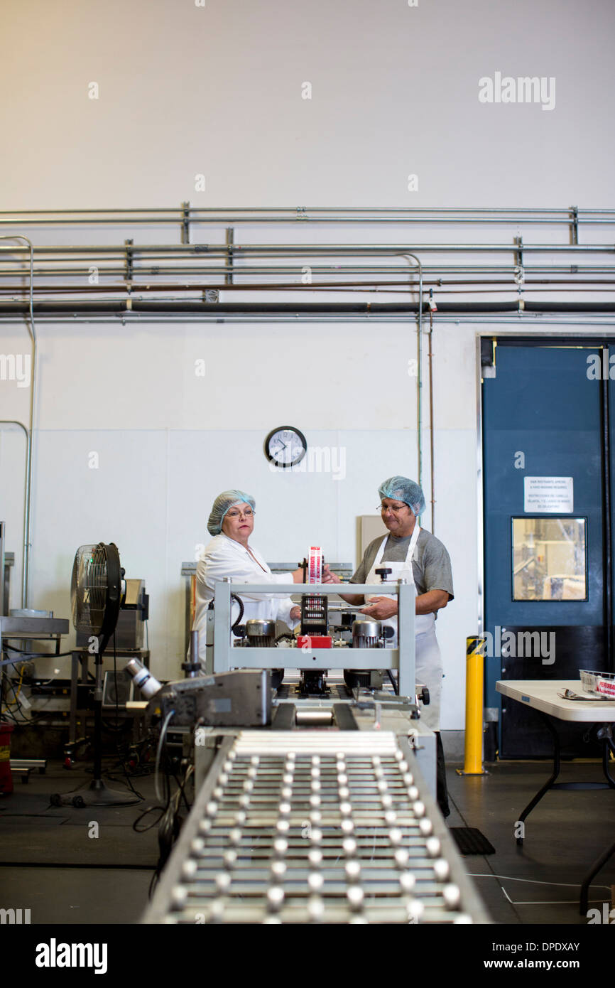Woman on production line hi-res stock photography and images - Alamy