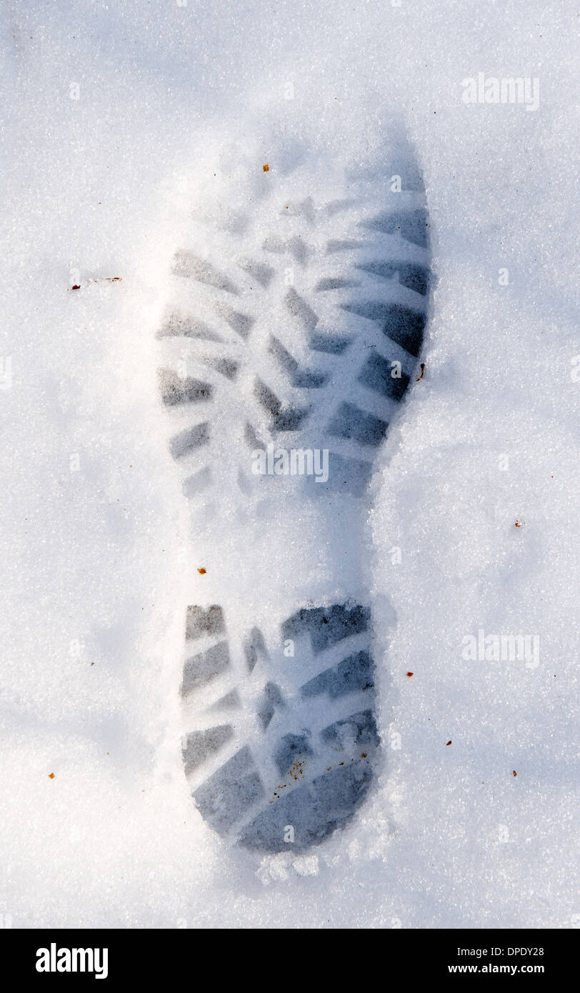 Footprint made by a hiking boot in the snow Stock Photo - Alamy