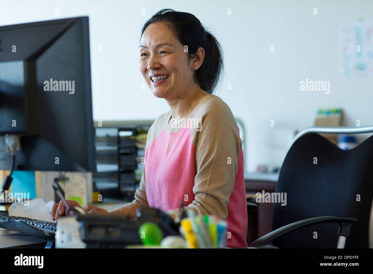 Senior woman using computer Stock Photo - Alamy