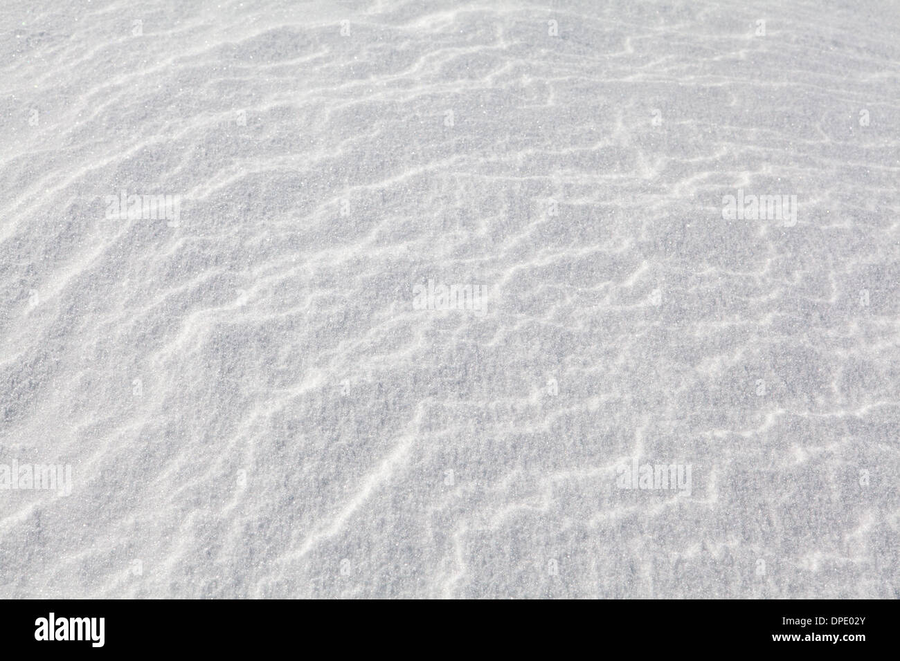 Snow patterns shaped by winds Stock Photo - Alamy