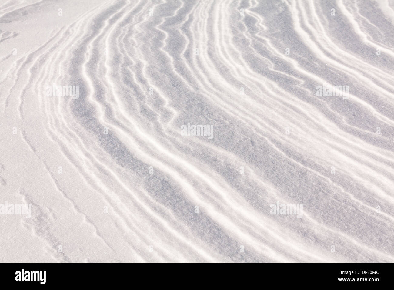 Snow patterns shaped by winds Stock Photo - Alamy