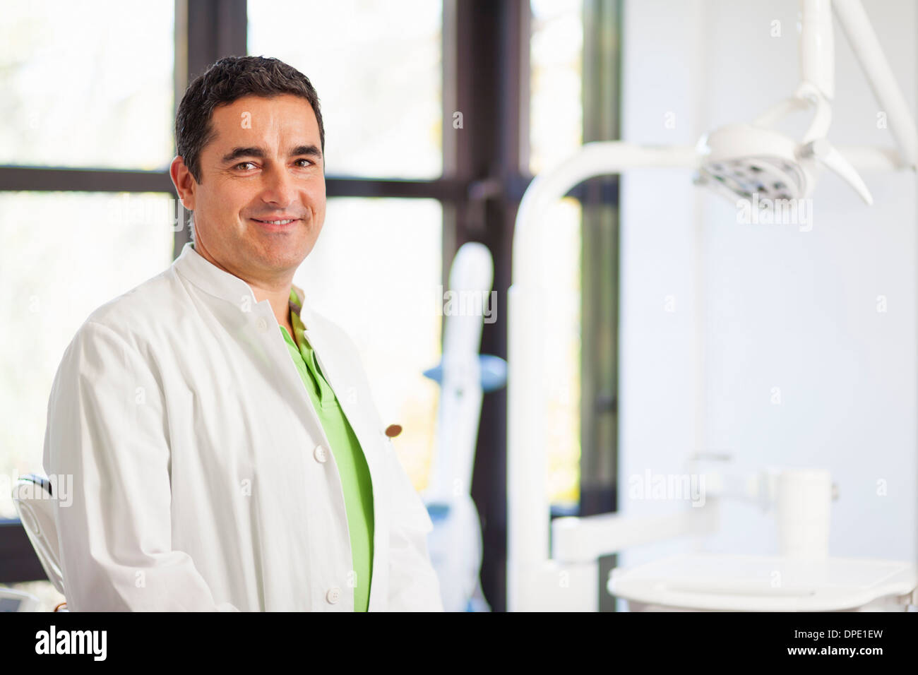 Dentist smiling looking at camera hi-res stock photography and images ...