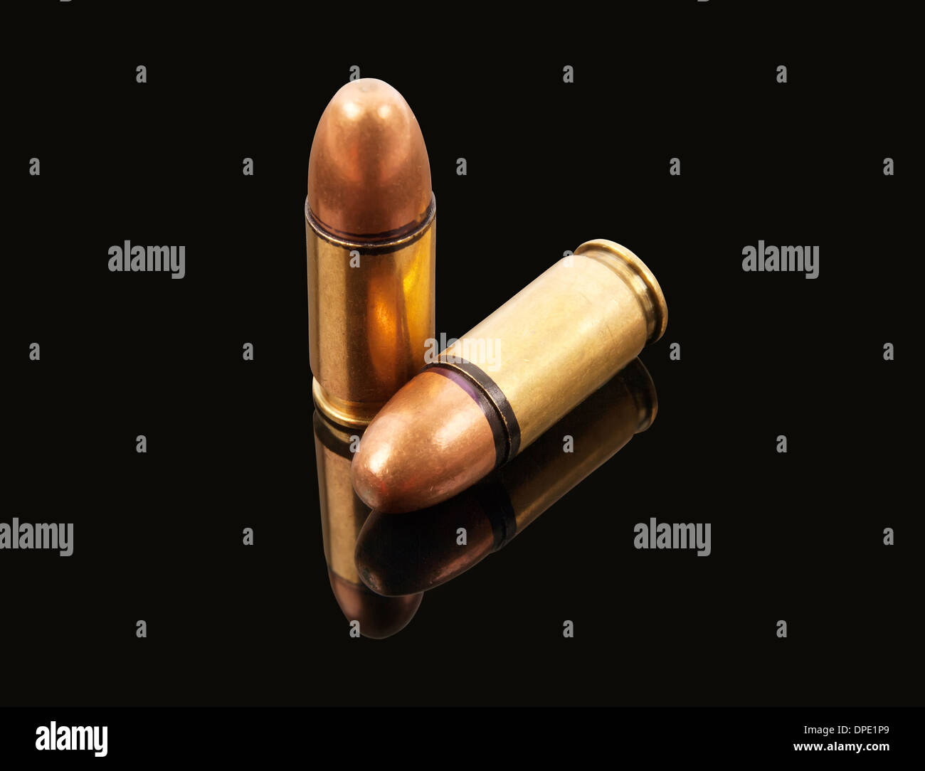 two bullets with reflection on black background Stock Photo - Alamy