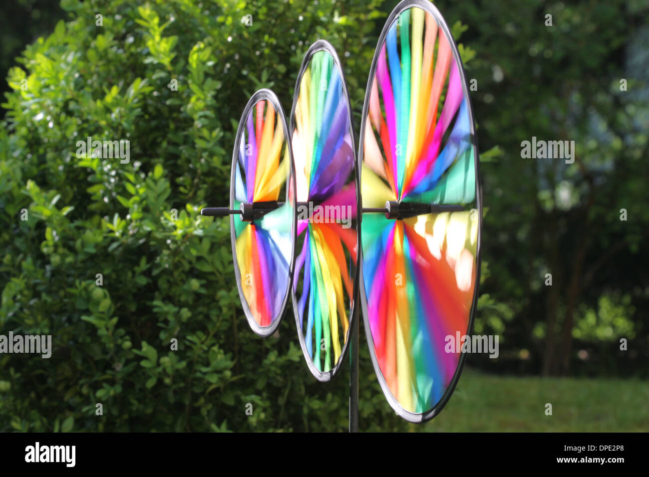 Colorful wind wheel in garden Stock Photo - Alamy