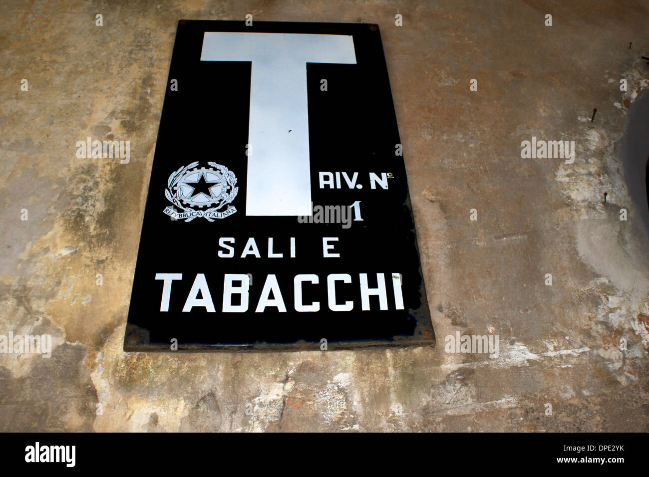 View of an old Sali e Tabacchi plack attached on an old city wall Stock ...
