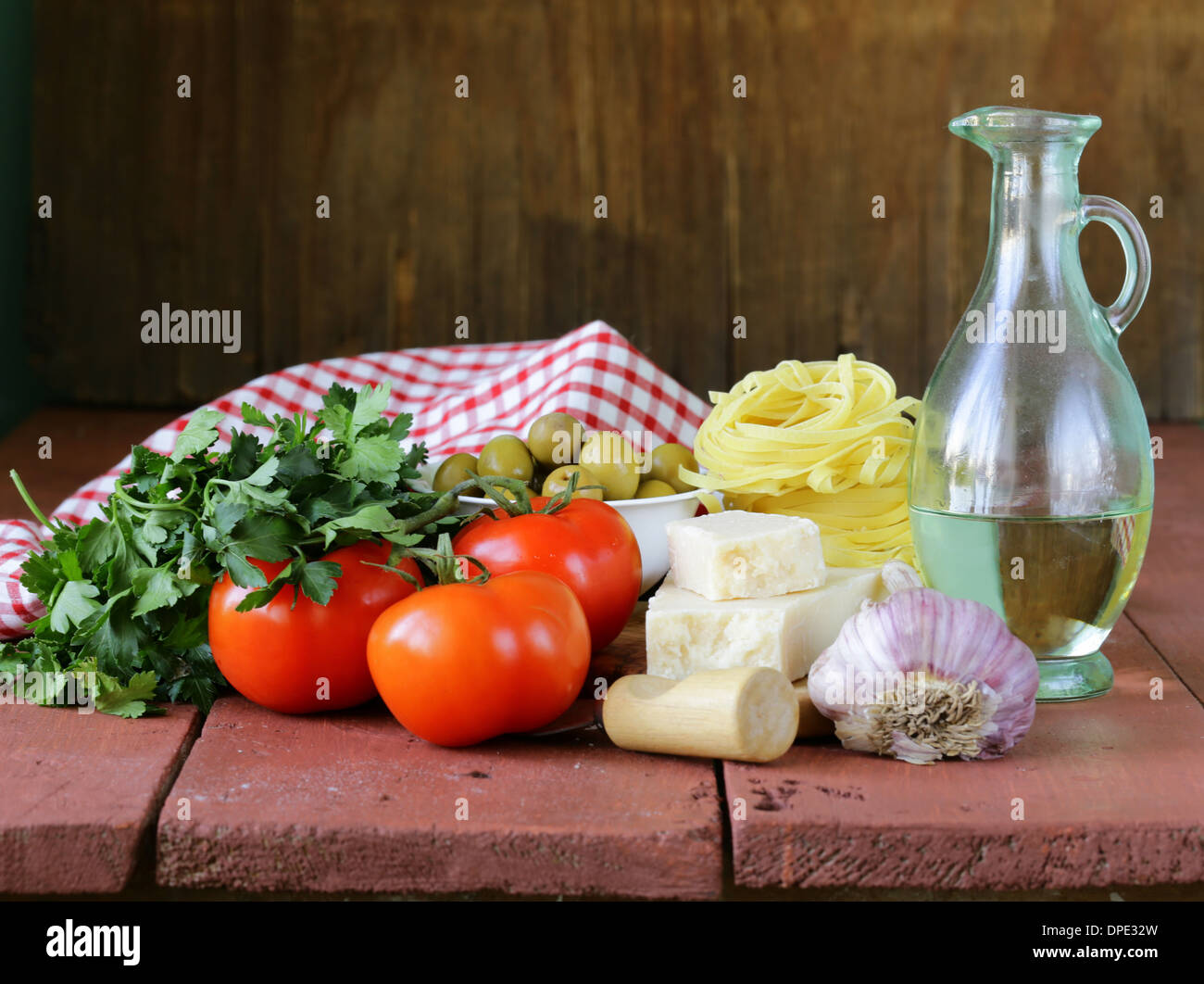 Italian food still life - pasta, olive oil, tomatoes, garlic Stock ...