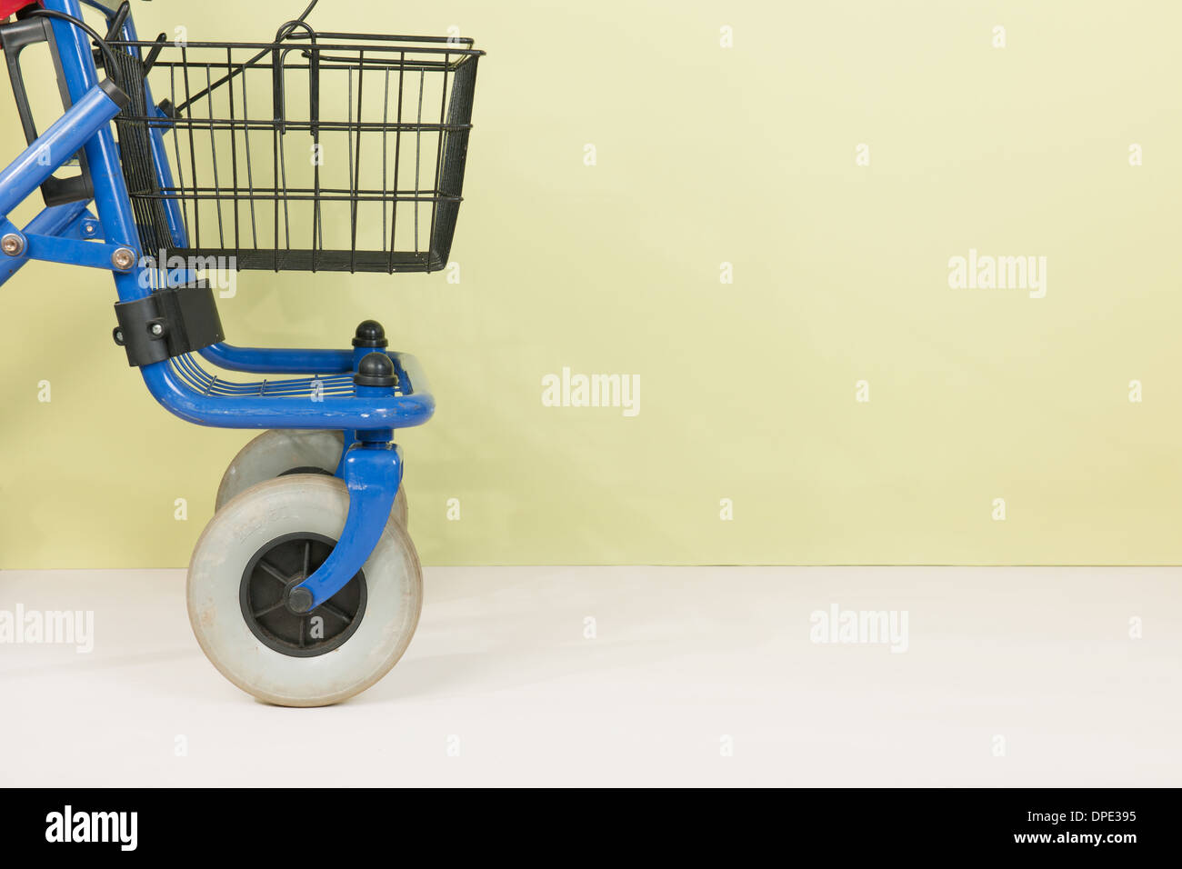 Detail blue walker on green background Stock Photo - Alamy