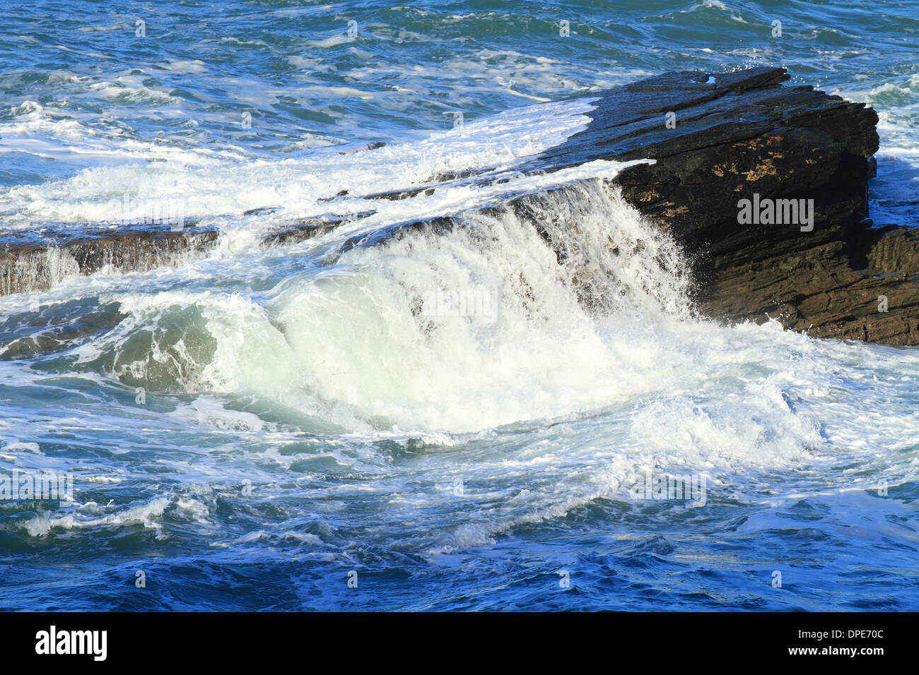 Breaking waves on rocky North Cornwall Coast, England, UK Stock Photo ...