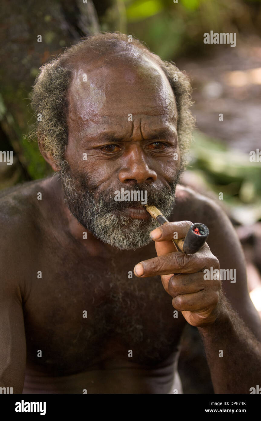 Vanuatuan man smoking a local pipe, Yakel Kastom (traditional culture ...